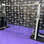 Cable crossover machine with dual adjustable pulleys